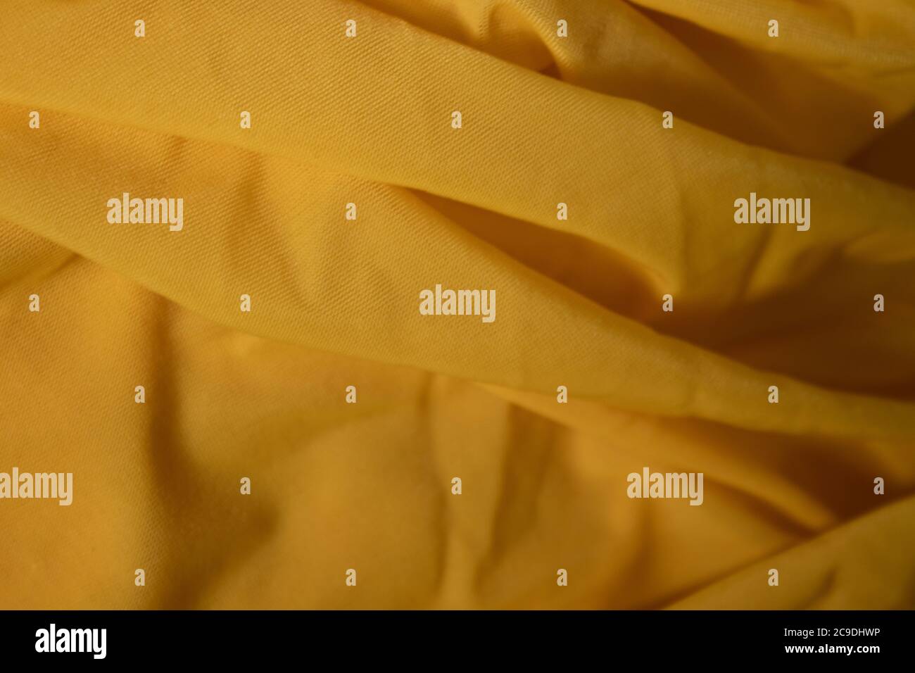 yellow fabric, silk background. suitable for design paper, banners ...