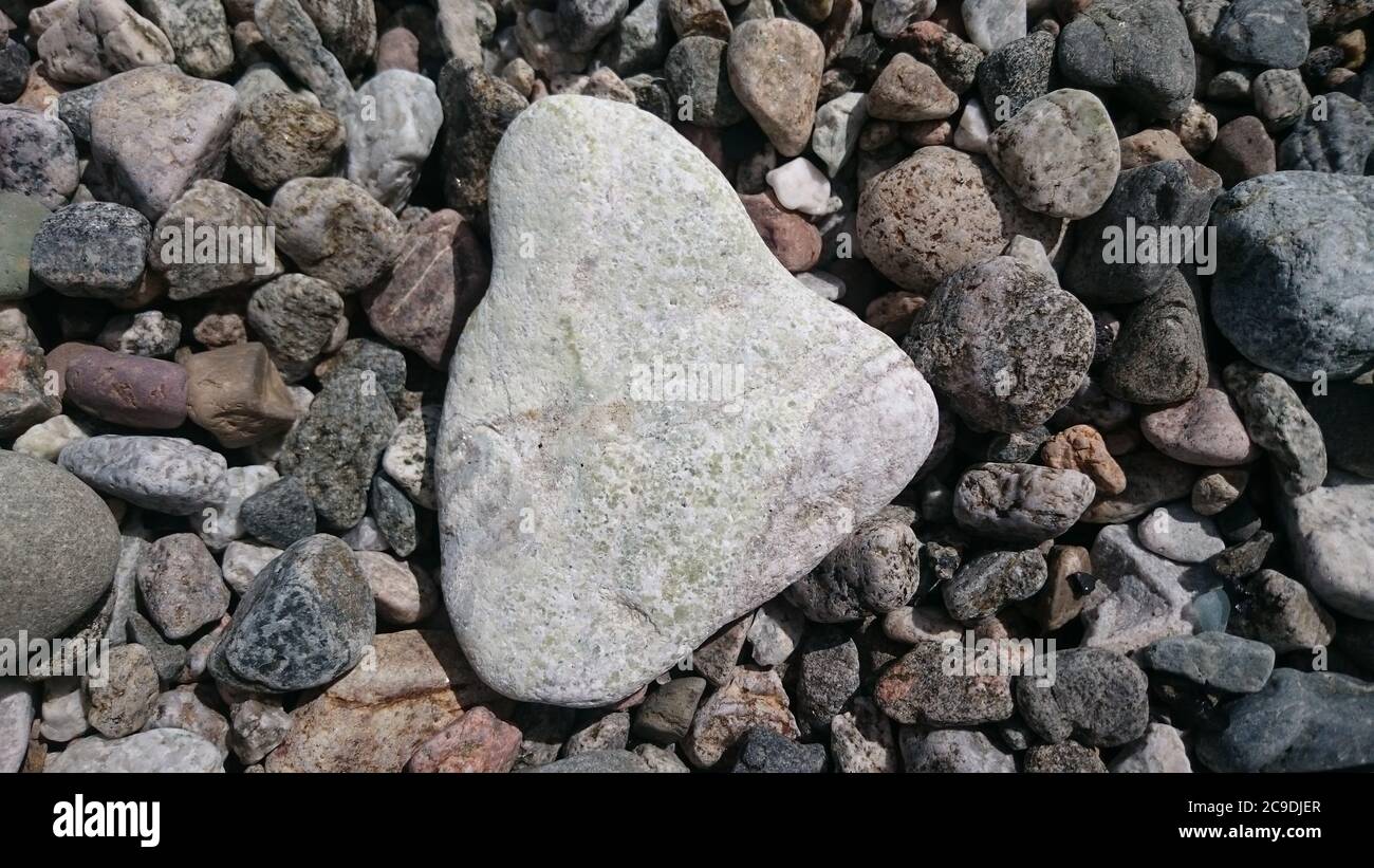 Rounded grey granite rocks beach hi-res stock photography and images ...