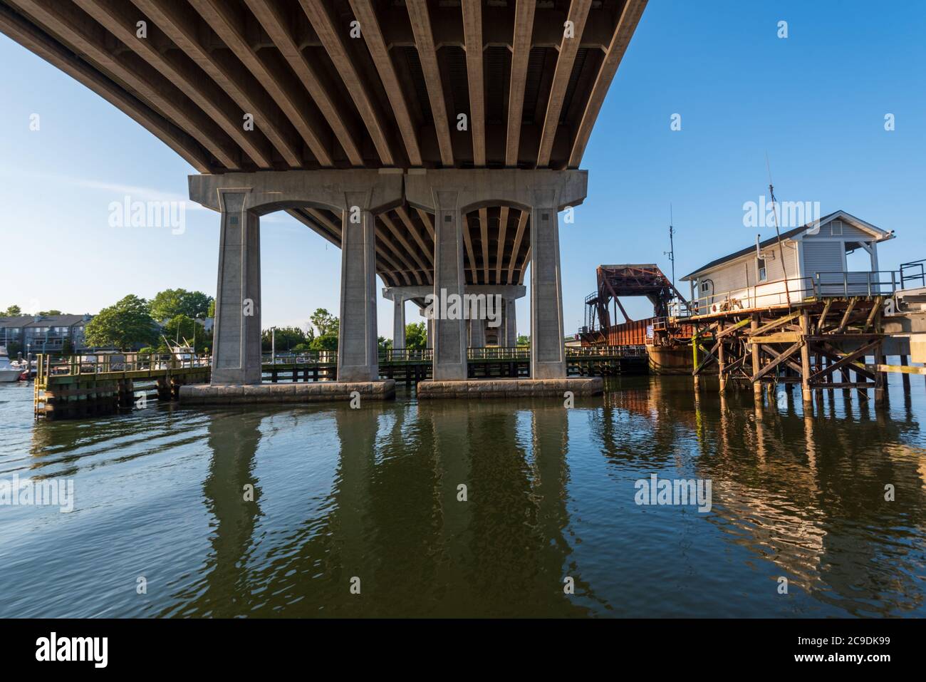 A wide angle photo looking up at a Shark river overpass by a drawbridge ...