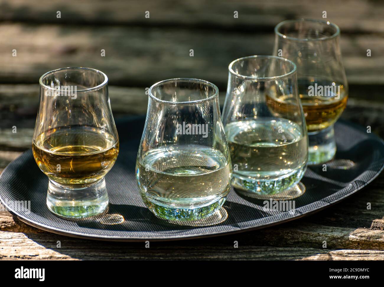 Tasting of different Scotch whiskies on outdoor terrace, dram of ...