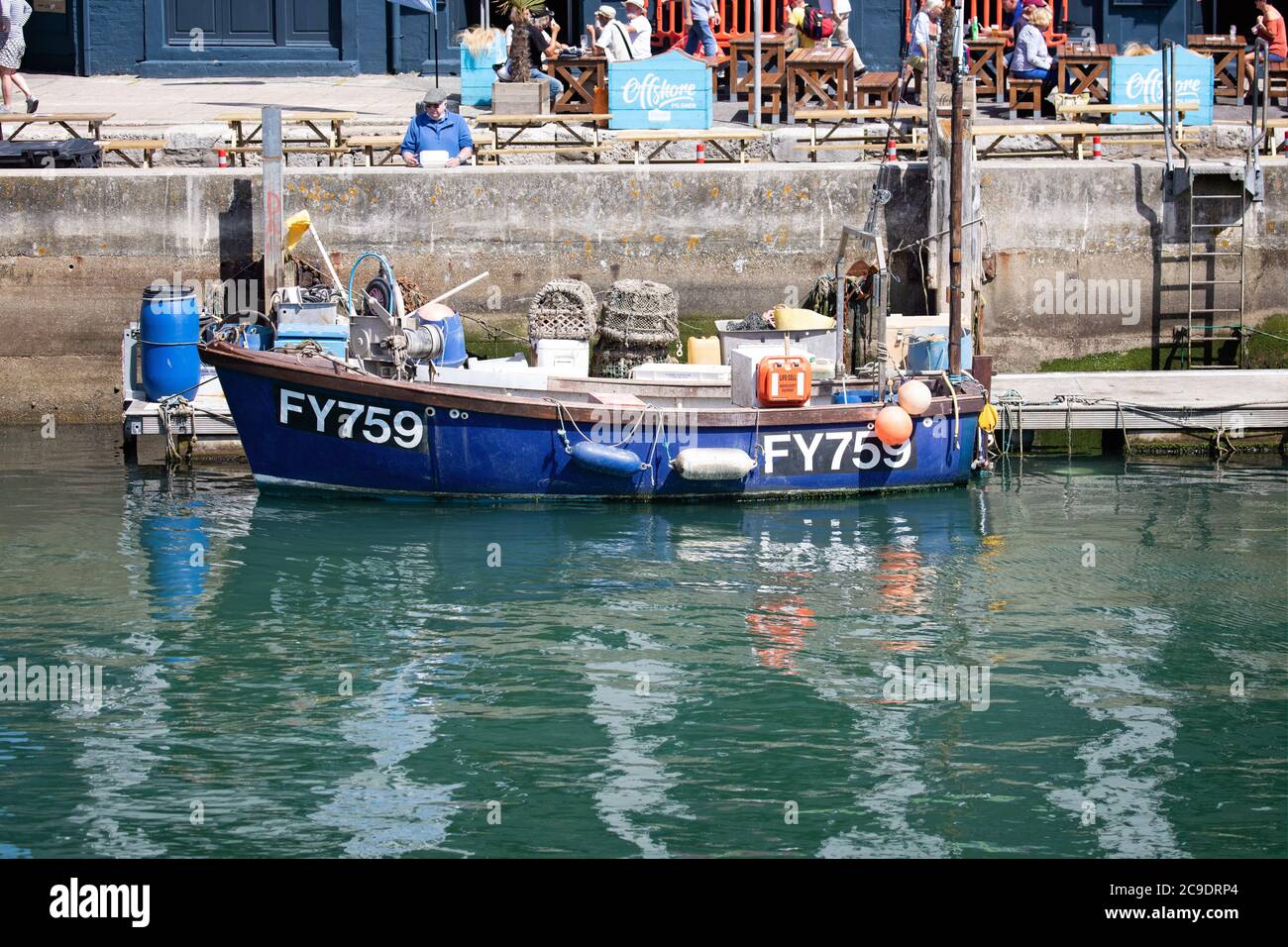 Small lobster boat moored alongside in Weymouth Harbour in Weymouth ...