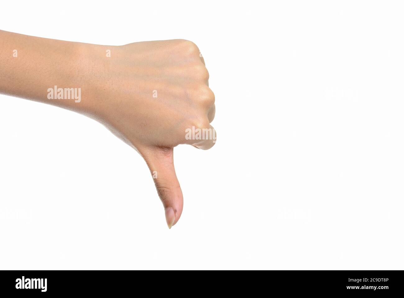 Portrait of hand giving thumbs down against white background Stock ...