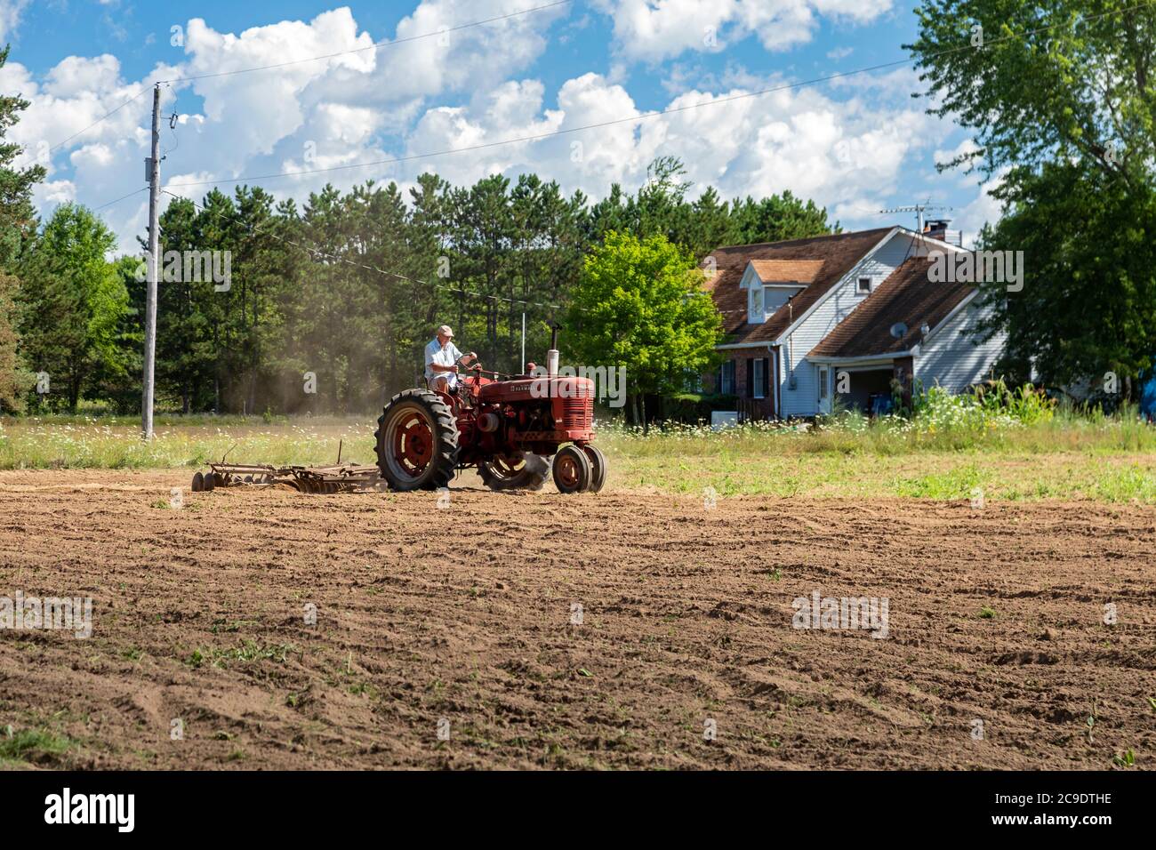Otsego, Michigan - A 90-year-old farmer drives a Farmall Model M ...