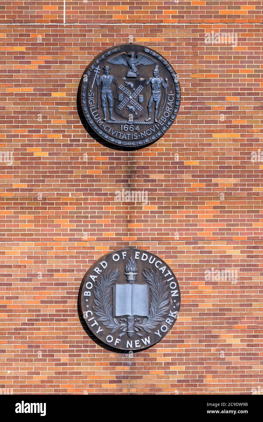 Insignia of the Department of Education, on the wall of a Bronx public ...