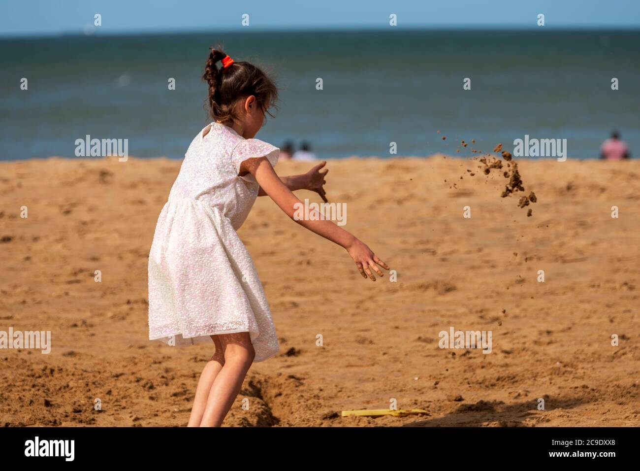 Girl On Beach In Dress