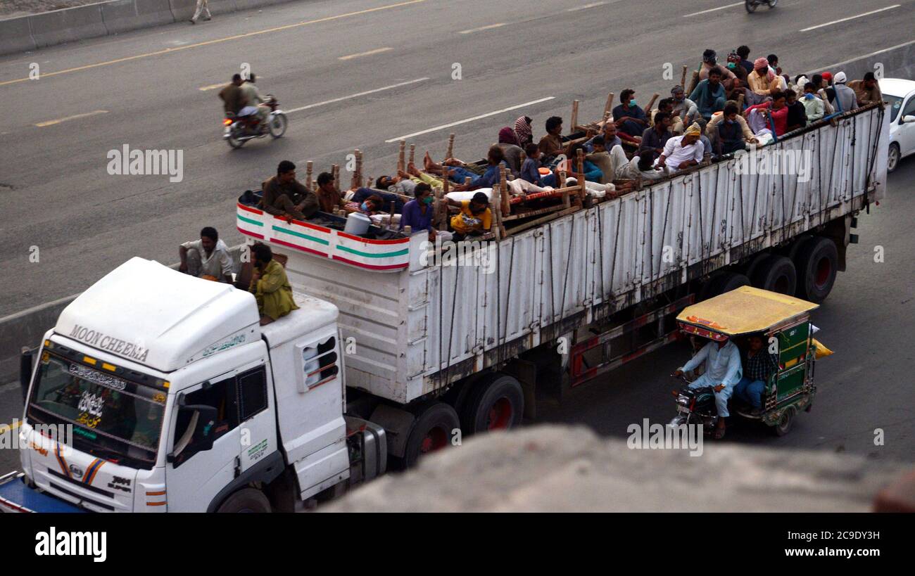 Lahore, Pakistan. 30th July, 2020. Pakistani passengers travel on the ...