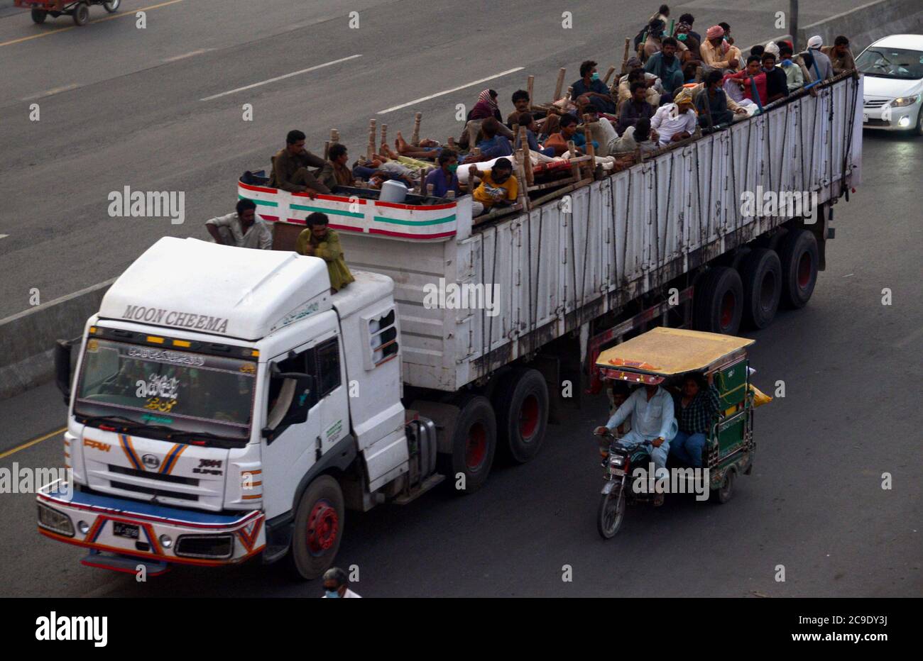 Lahore, Pakistan. 30th July, 2020. Pakistani passengers travel on the ...