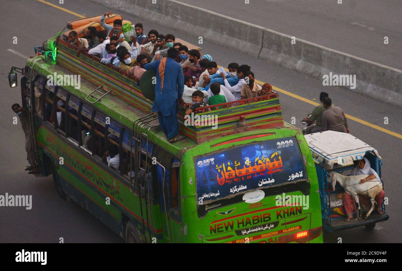 Lahore, Pakistan. 30th July, 2020. Pakistani passengers travel on the ...
