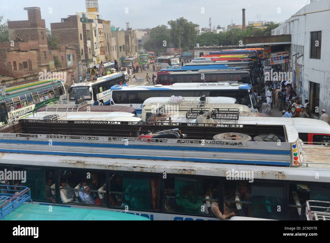 Lahore, Pakistan. 30th July, 2020. Pakistani passengers travel on the ...