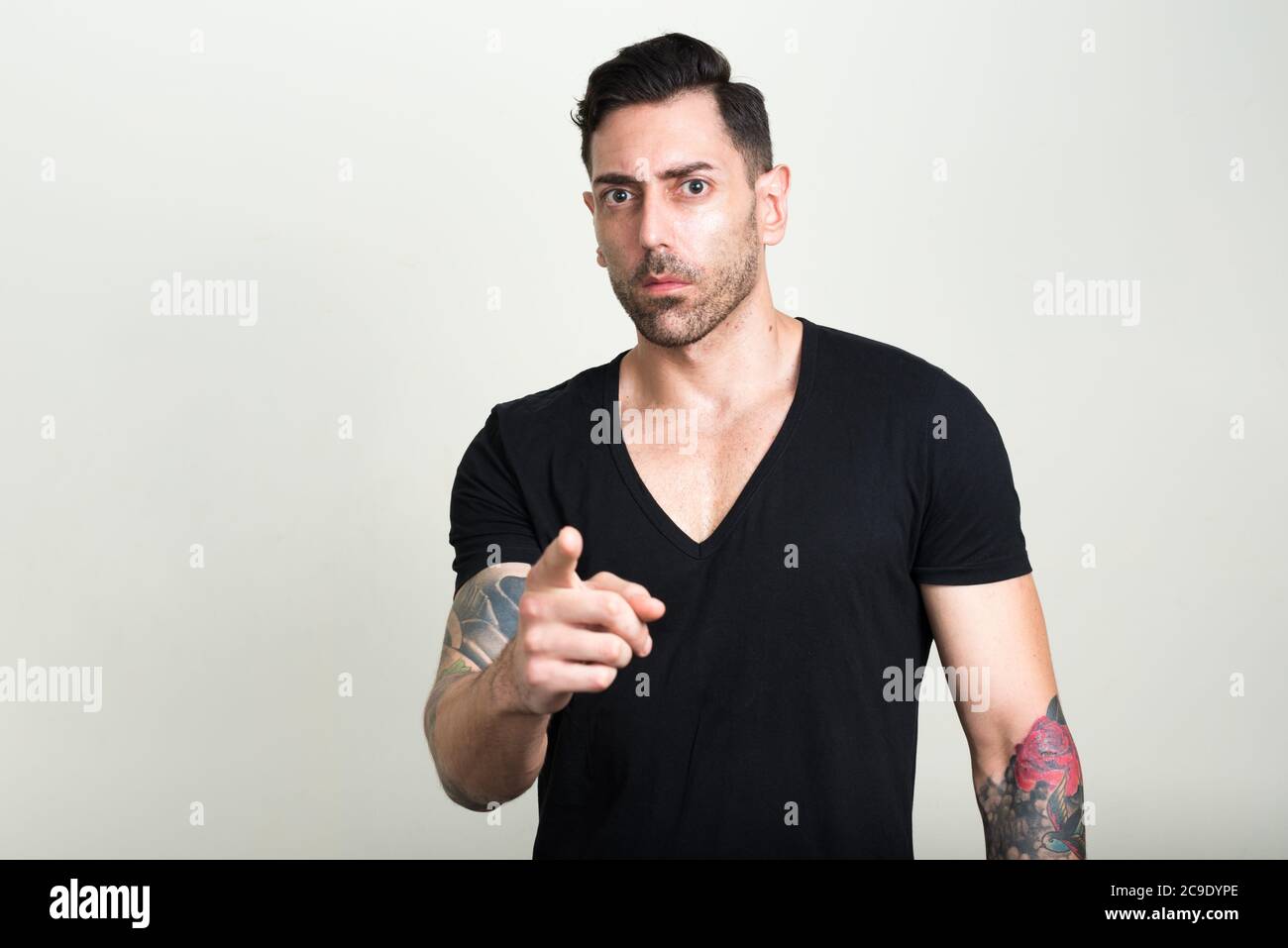 Portrait of handsome bearded man as rebel Stock Photo - Alamy