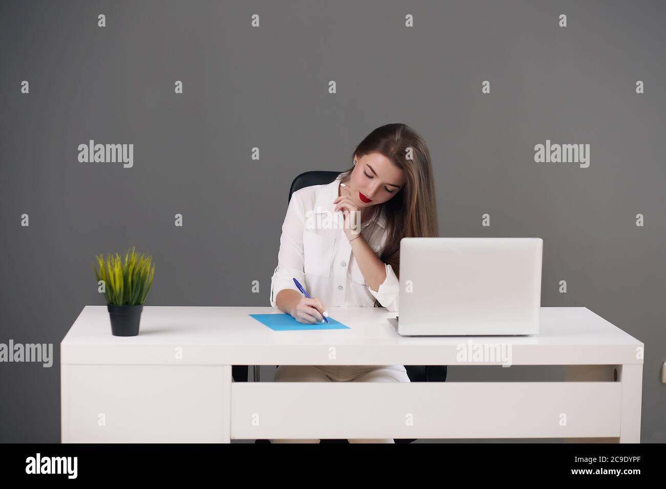 Pretty girl develops project plan and concept. Business lady Stock ...