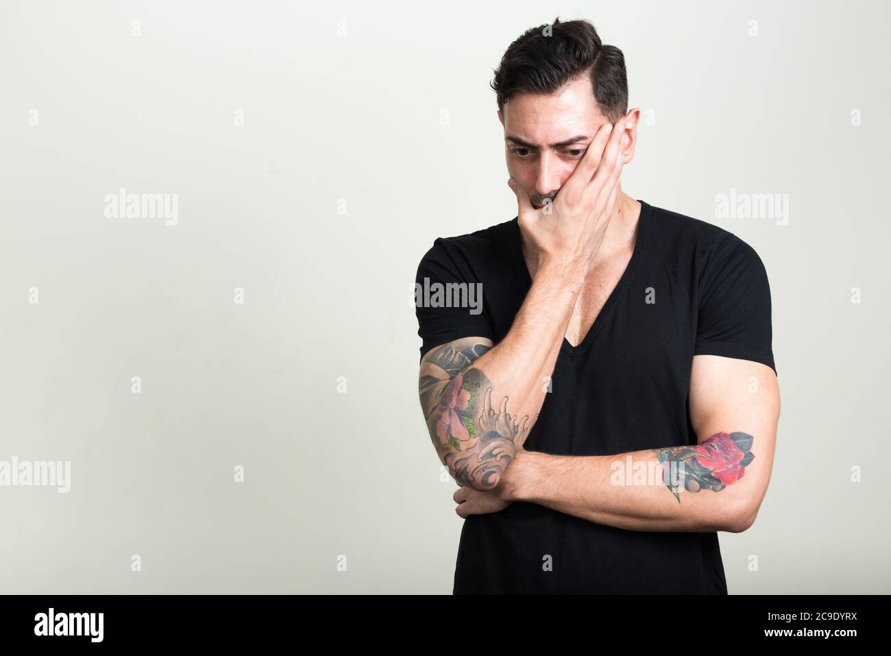 Portrait of handsome bearded man as rebel Stock Photo - Alamy