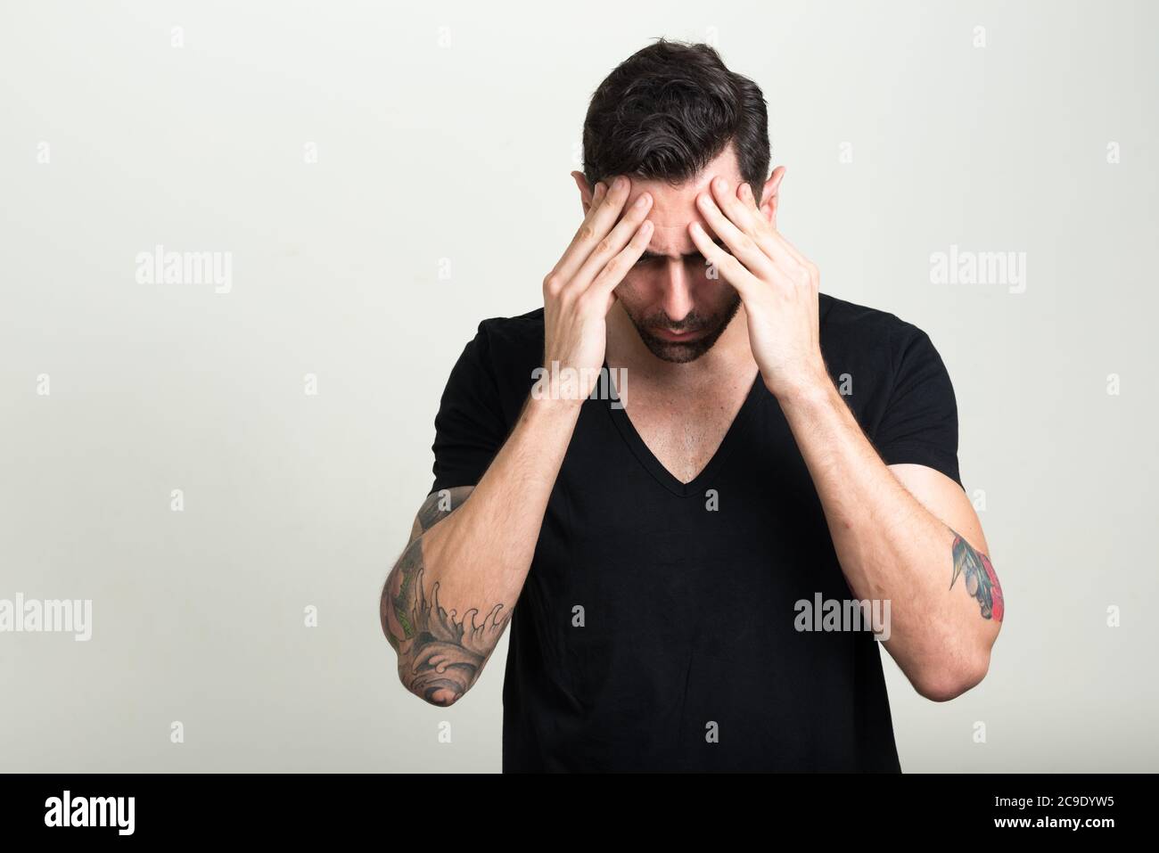 Portrait of handsome bearded man as rebel Stock Photo - Alamy