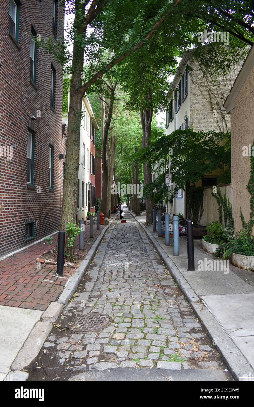 A Cobblestone Allway in the City of Philadelphia with Brick Buildings ...