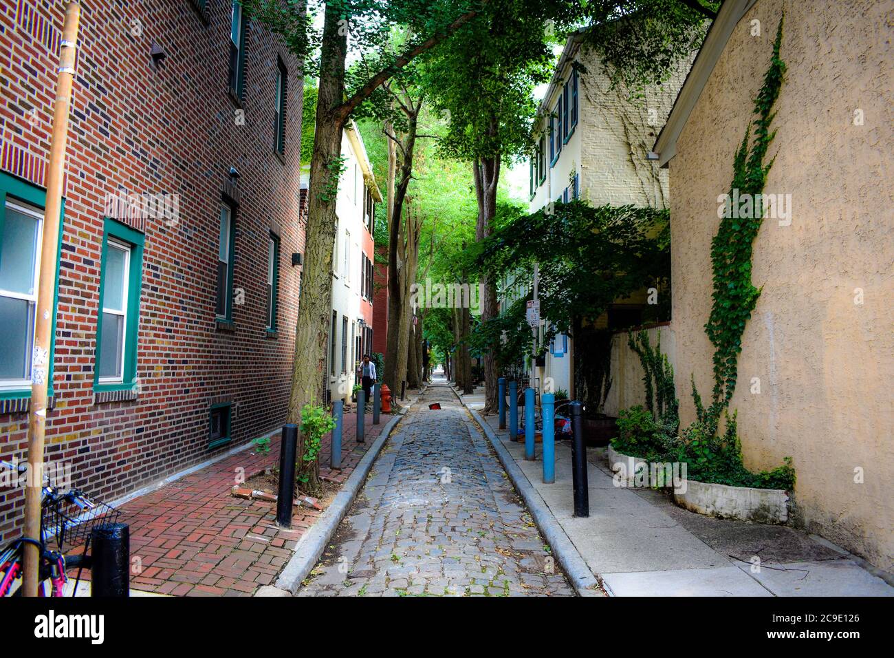 A Cobblestone Allway in the City of Philadelphia with Brick Buildings ...