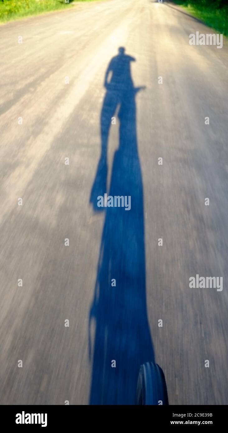 Male shadow on road hi-res stock photography and images - Alamy