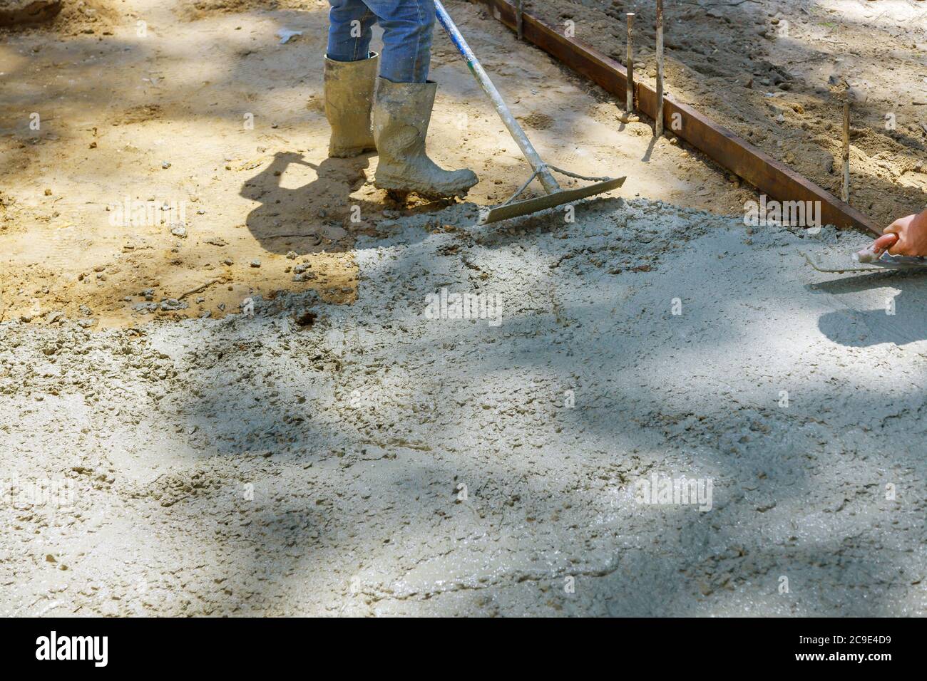 Process of installing construction of new sidewalks laying concrete ...