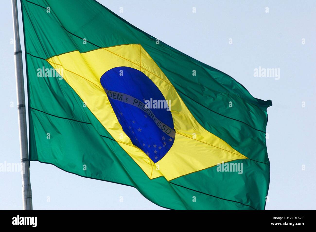 brazilian flag with a blue sky. Brazil Stock Photo - Alamy