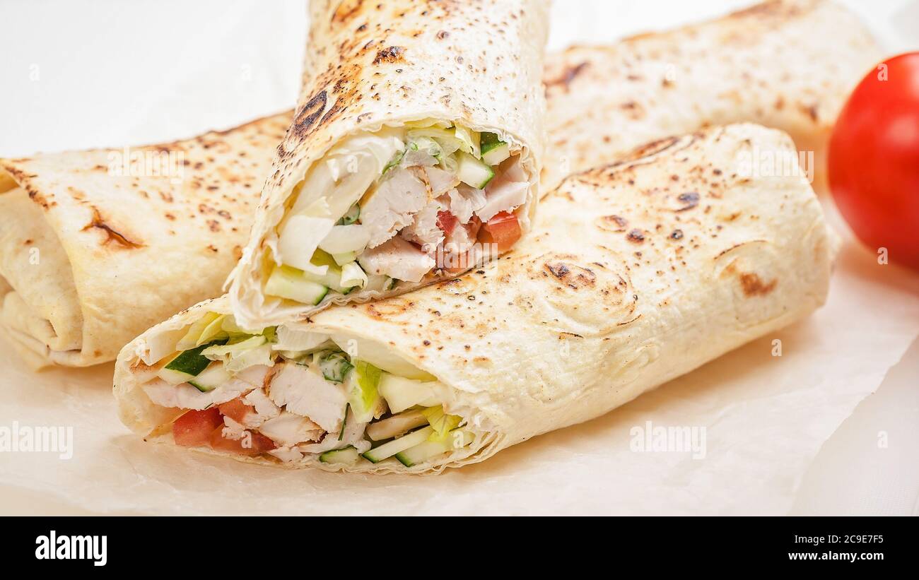 Traditional shawarma with chicken. Roll in a wheat tortilla with ...