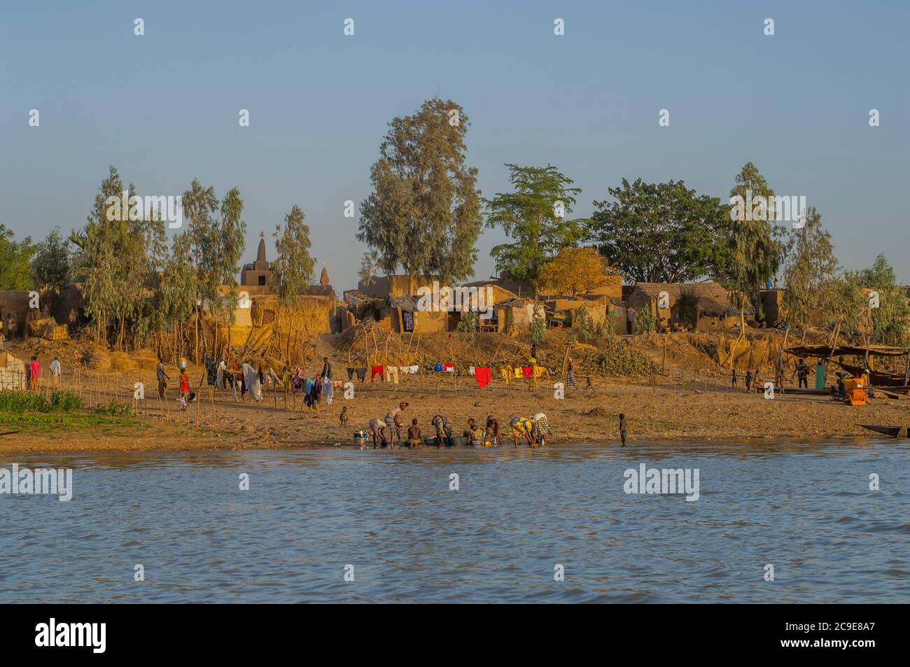View of a small village with laundry drying from the Bani River, near ...