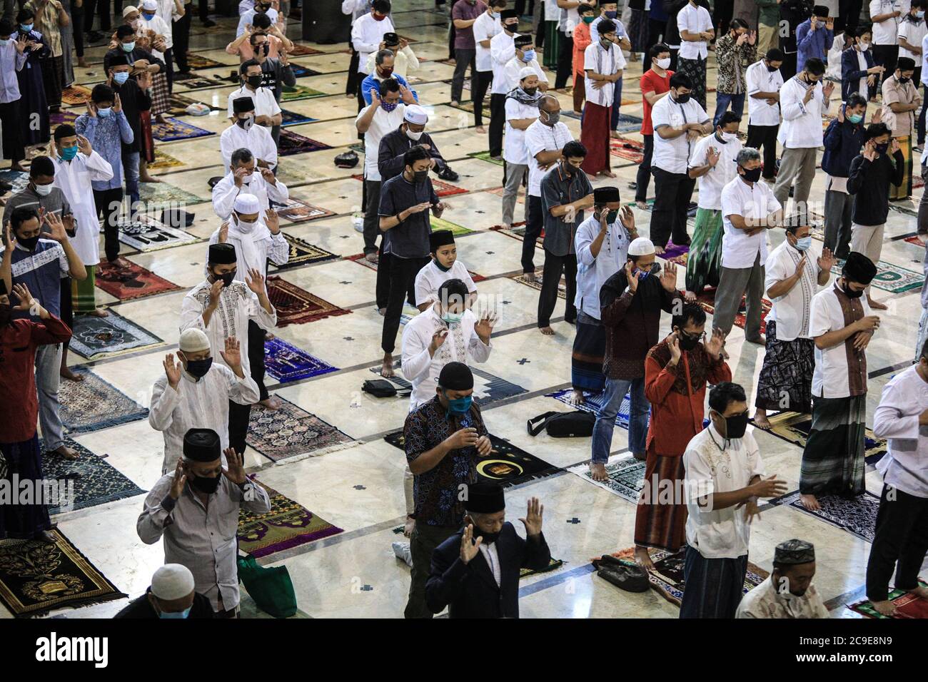 Bandung, West Java, Indonesia. 31st July, 2020. Muslims people perform Eid al-Adha prayer by ...