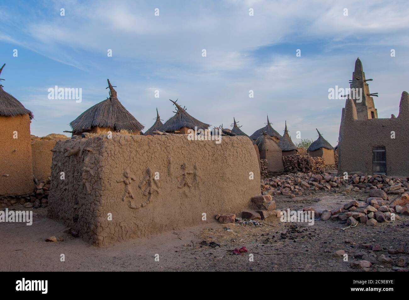 Mudbrick granaries and a mosque in the Djiguibombo Dogon village in the ...