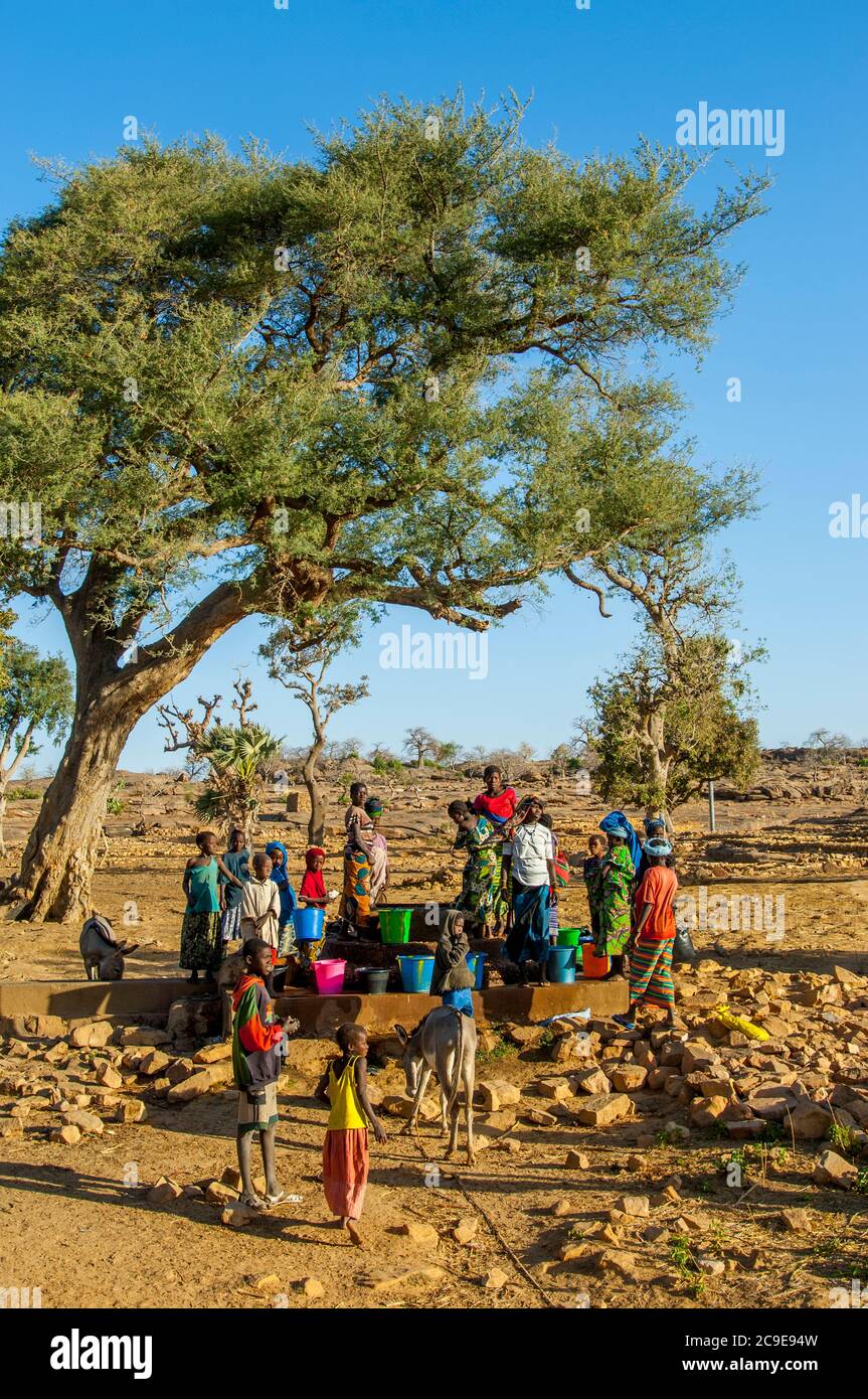 Local people getting water from a well near the village of Sangha in ...
