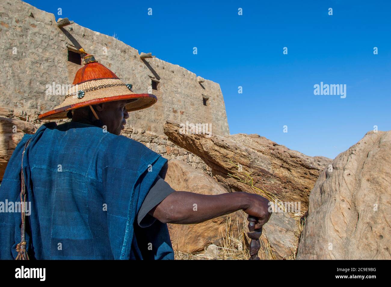 A Dogon man in a village at the Bandiagara Escarpment in the Dogon ...