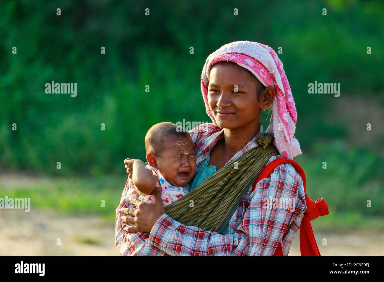 Bagan/Myanmar-October4th 2019: A native Burmese woman is carrying a ...