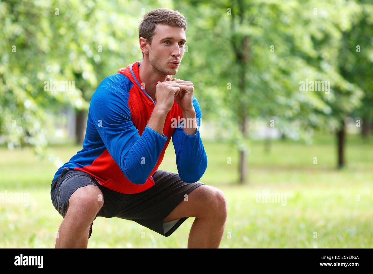 Squatting man hi-res stock photography and images - Alamy