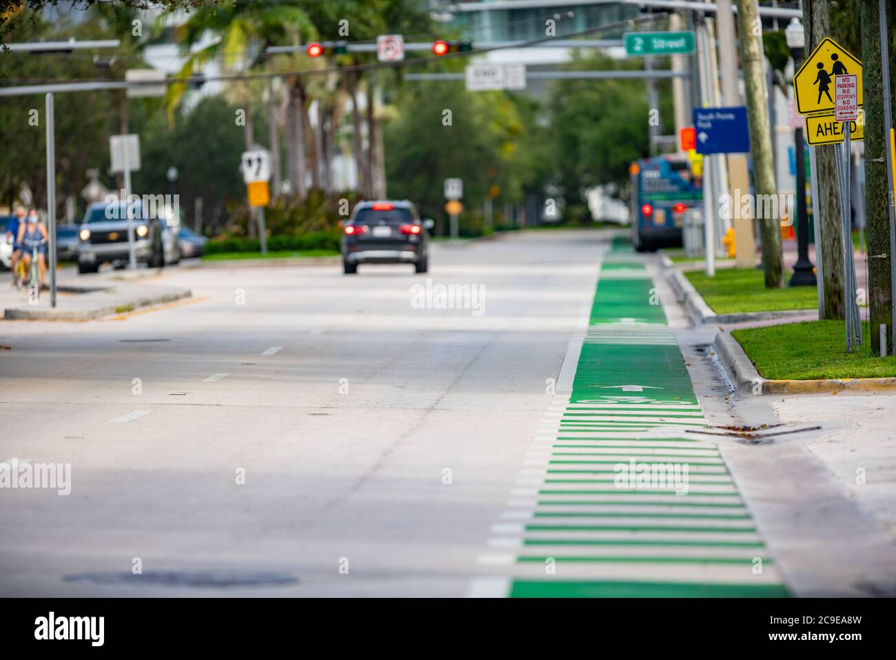 Green painted bike lanes in the city Stock Photo - Alamy