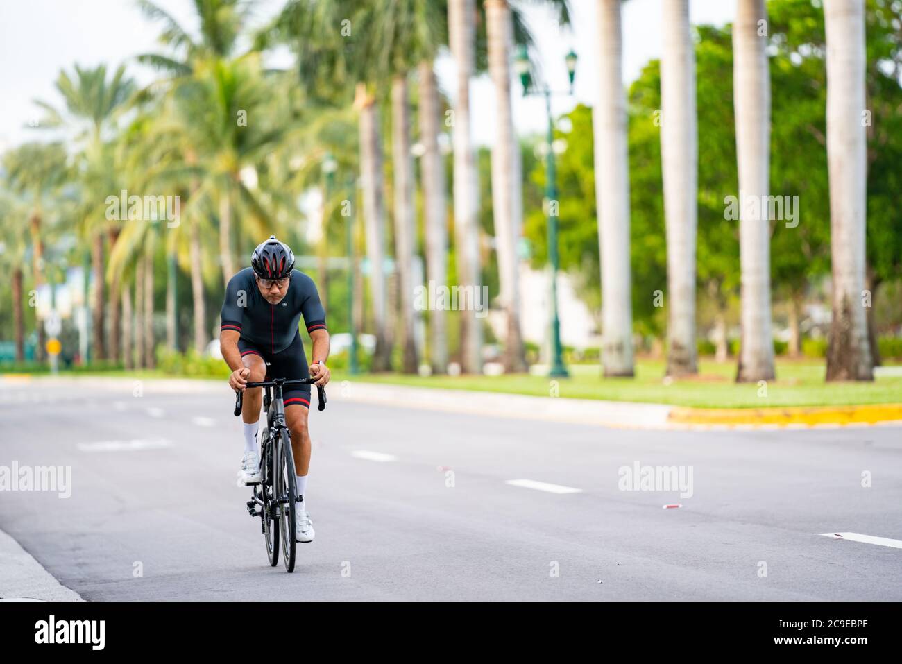 Man riding a racing bike Stock Photo - Alamy
