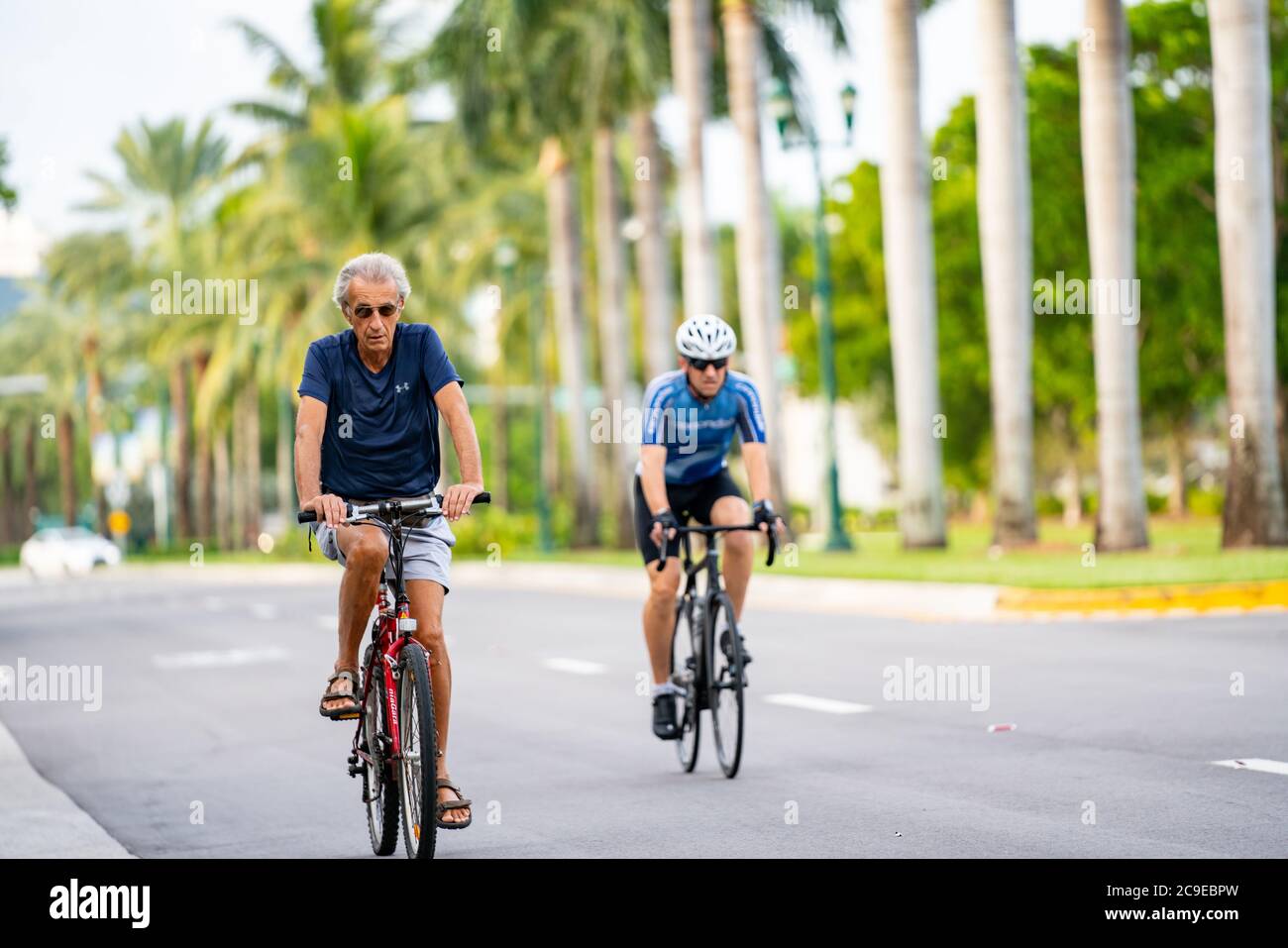 Senior man riding a bike Stock Photo - Alamy