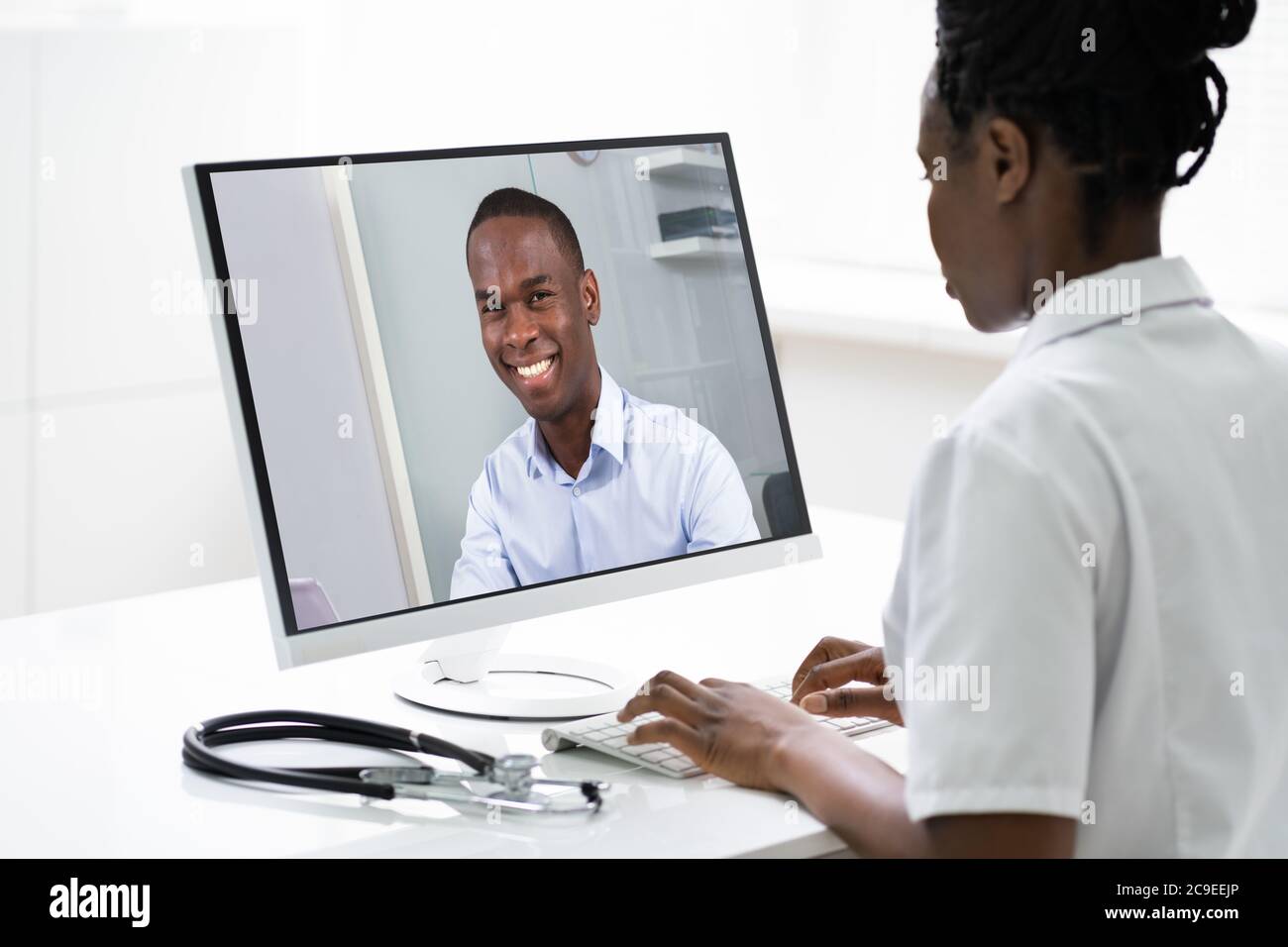 African Doctor In Video Conference Call Talking With Patient Stock ...