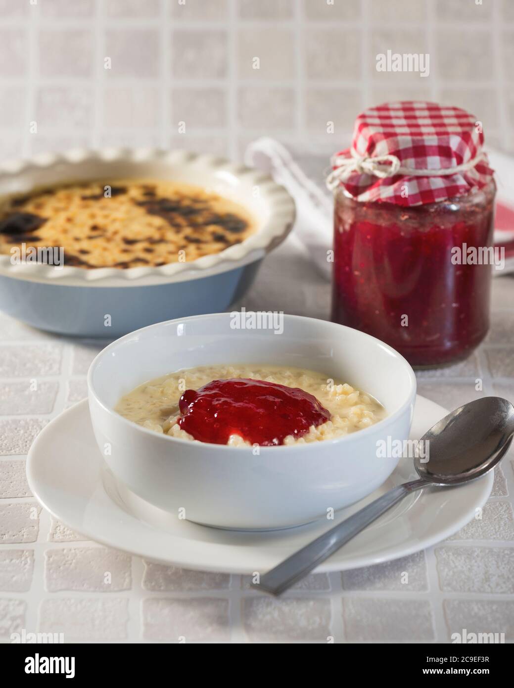 Rice pudding with jam. Traditional dessert UK Stock Photo - Alamy