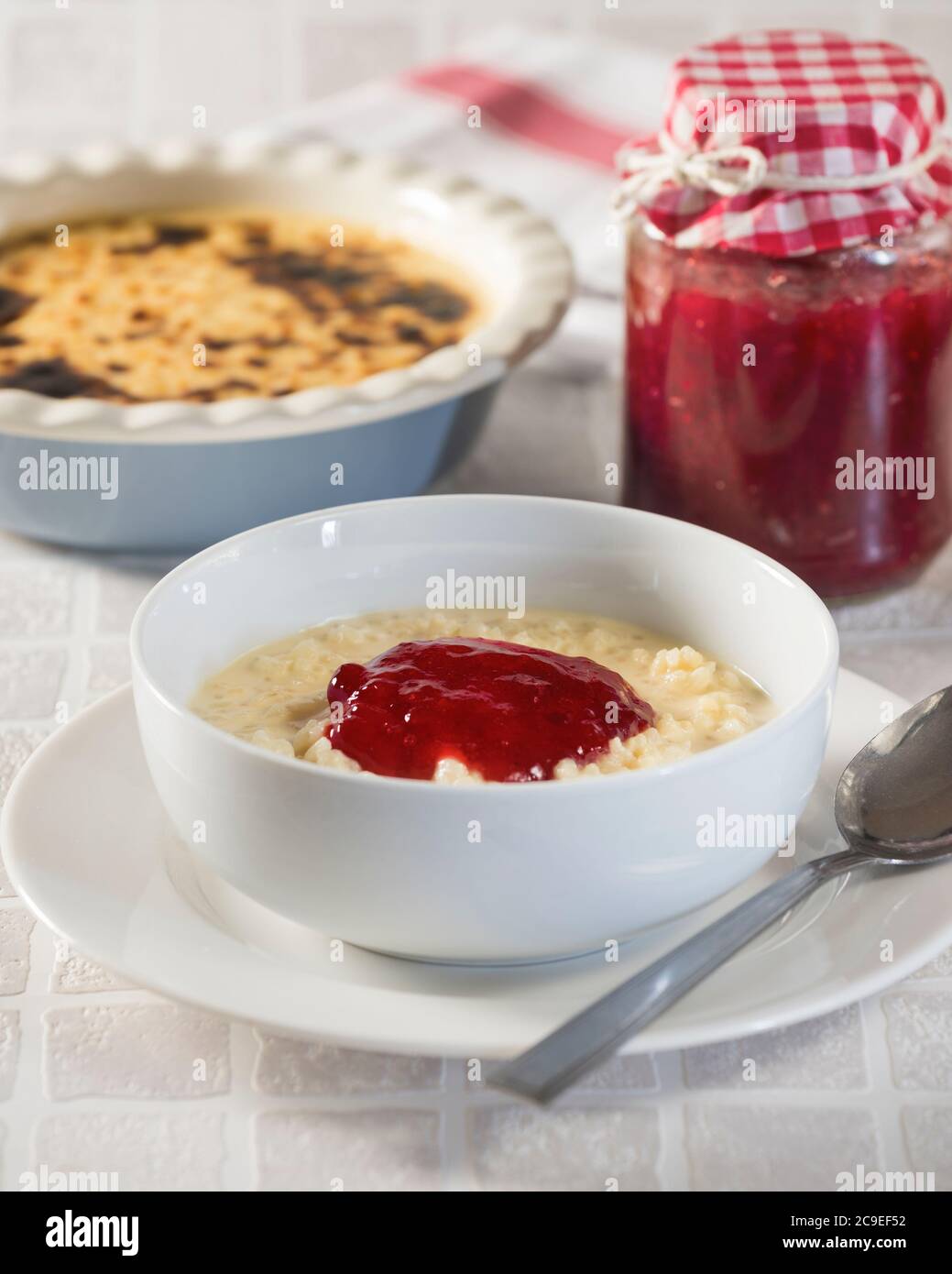 Rice pudding with jam. Traditional dessert UK Stock Photo - Alamy