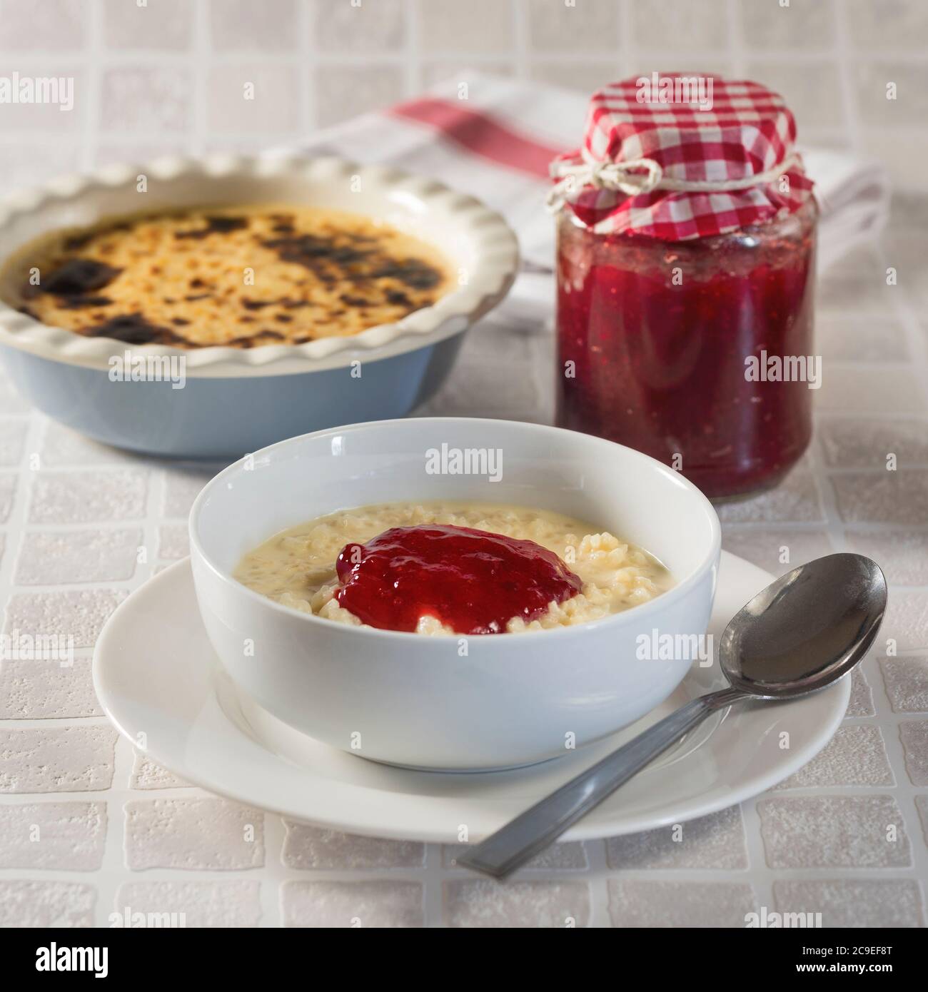 Rice pudding with jam. Traditional dessert UK Stock Photo - Alamy