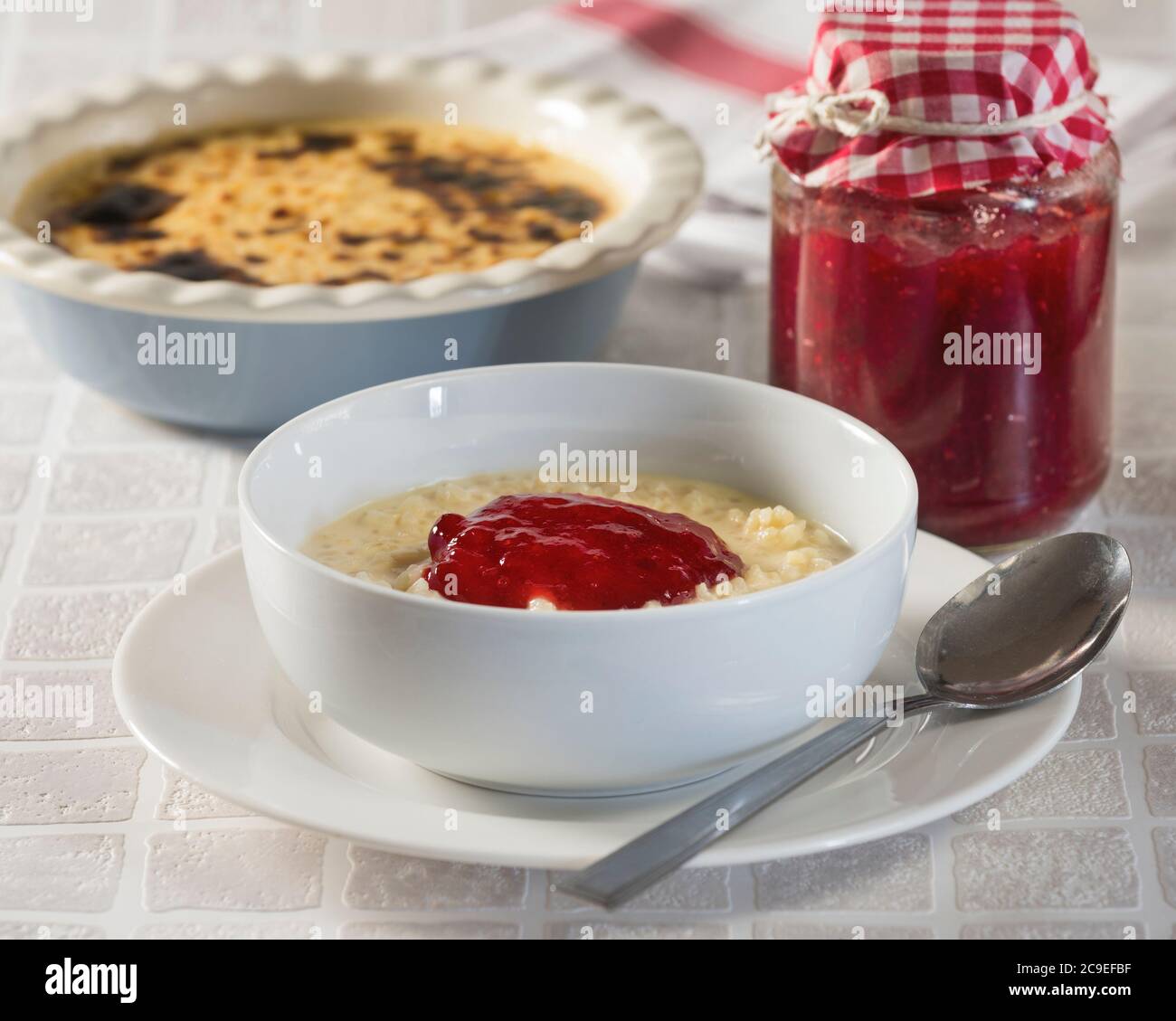 Rice pudding with jam. Traditional dessert UK Stock Photo - Alamy