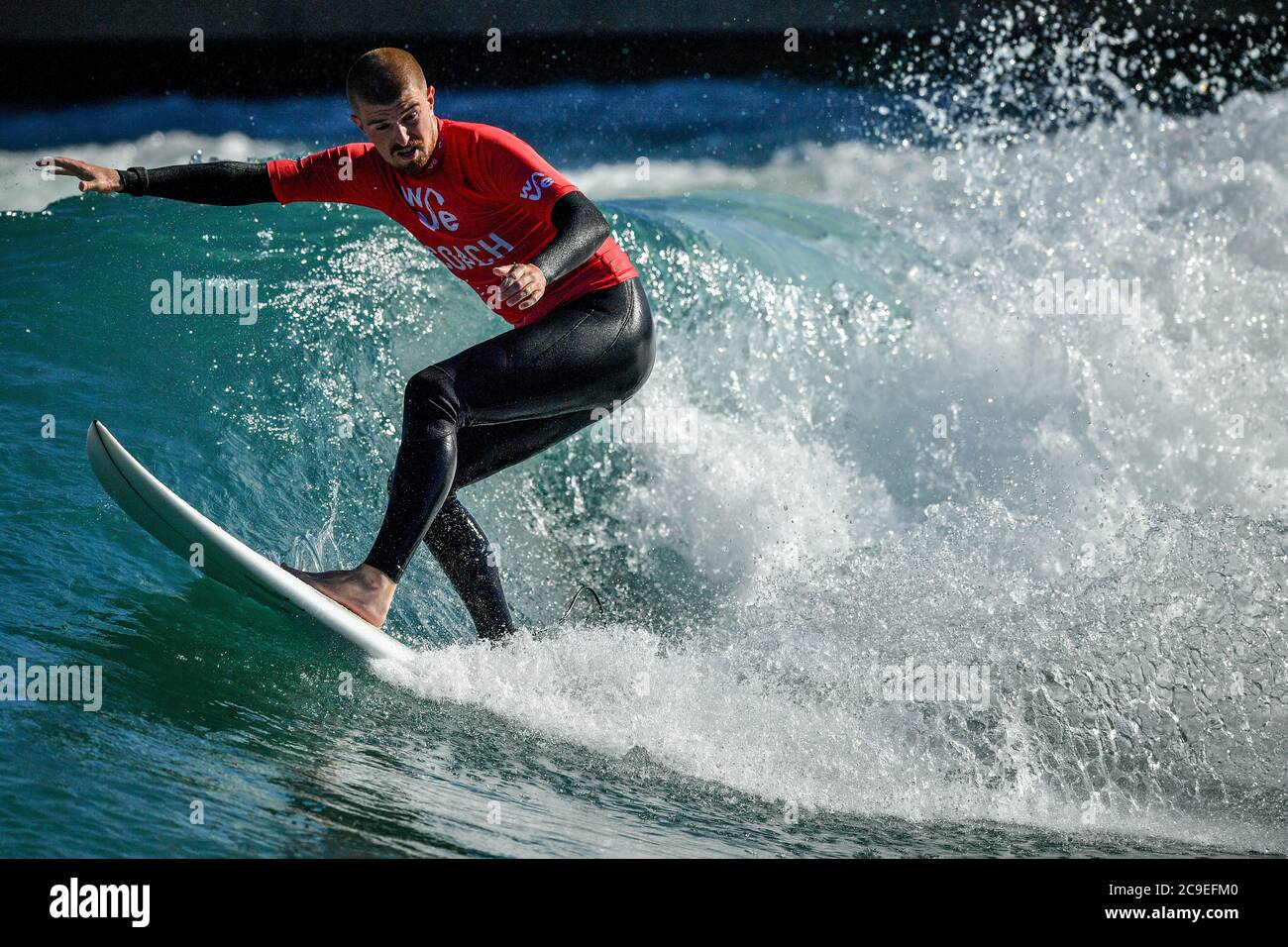 Staff enjoy a surf session after a days training at the Wave surfing ...
