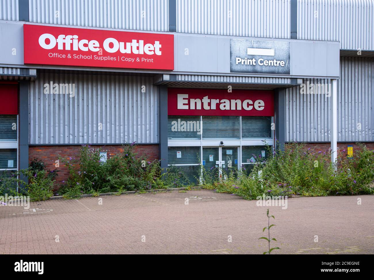 Office Outlet business closed down weeds growing in entrance, Ipswich ...