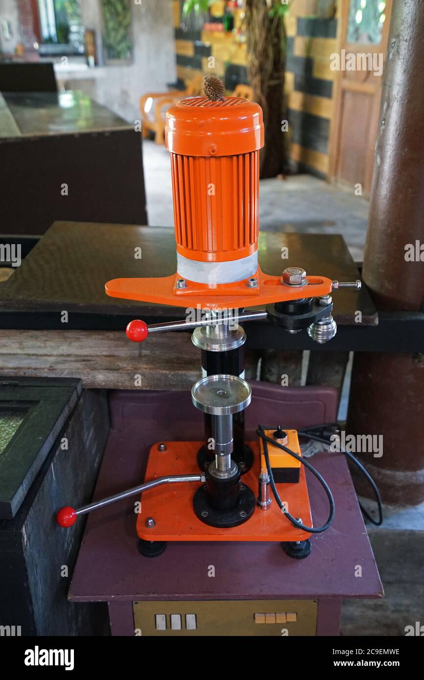 Orange antique Thai ice shaver Stock Photo - Alamy