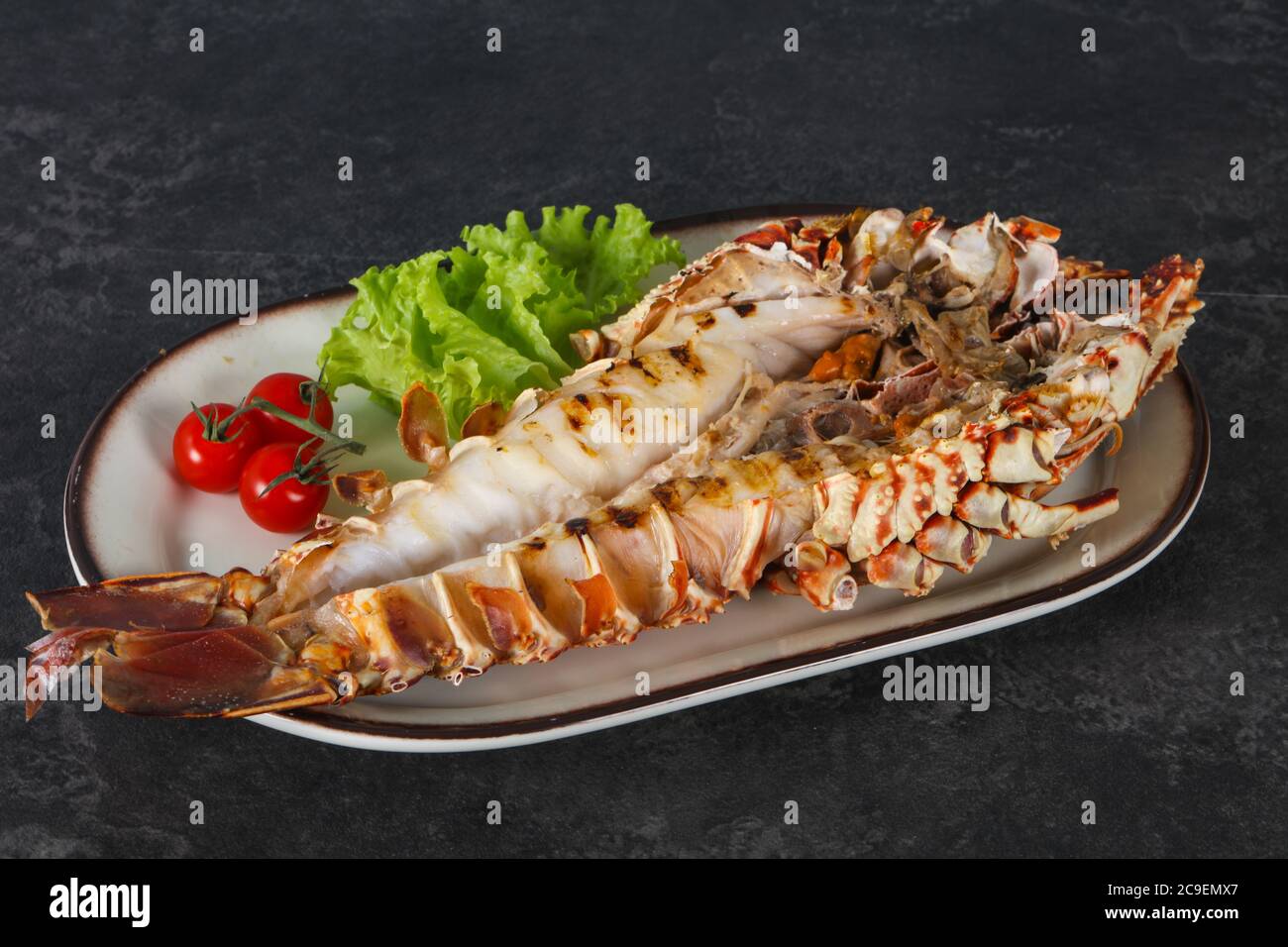 Grilled crayfish in the plate served salad Stock Photo - Alamy