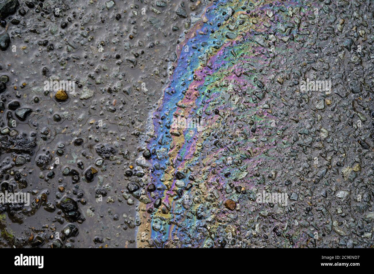 Gasoline flows on the pavement Stock Photo - Alamy