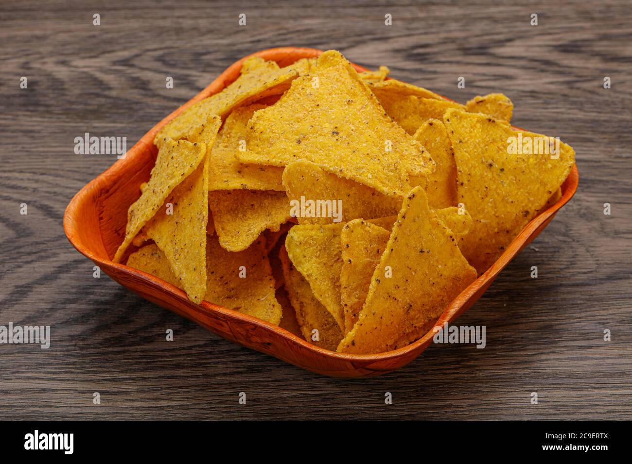 Mexican crunchy corn nachos triangle heap Stock Photo - Alamy