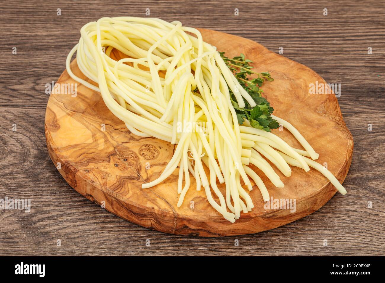 Chechil spaghetti cheese snack over board Stock Photo - Alamy
