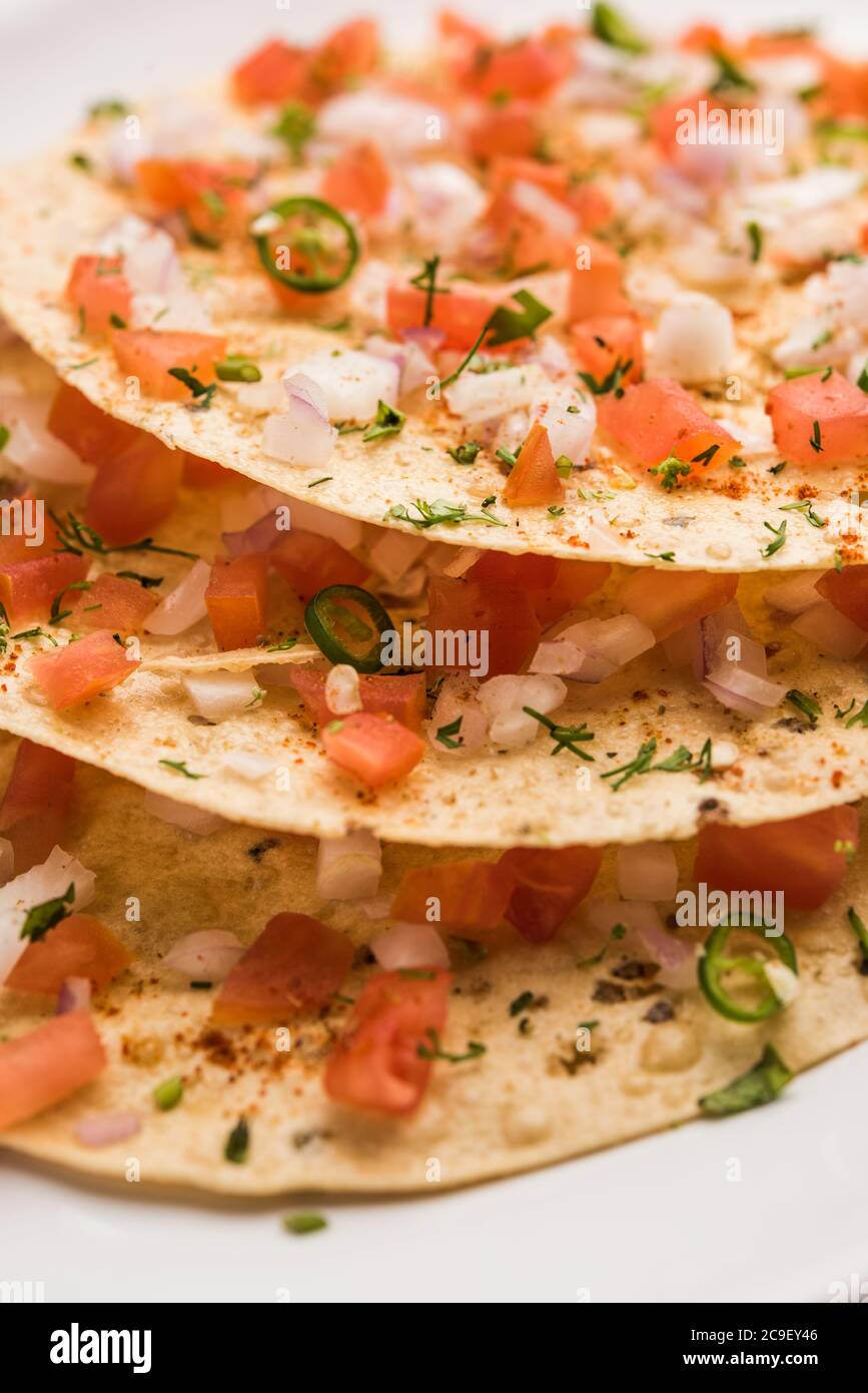 Masala Papad or papadum is a delicious Indian snack made using roasted ...
