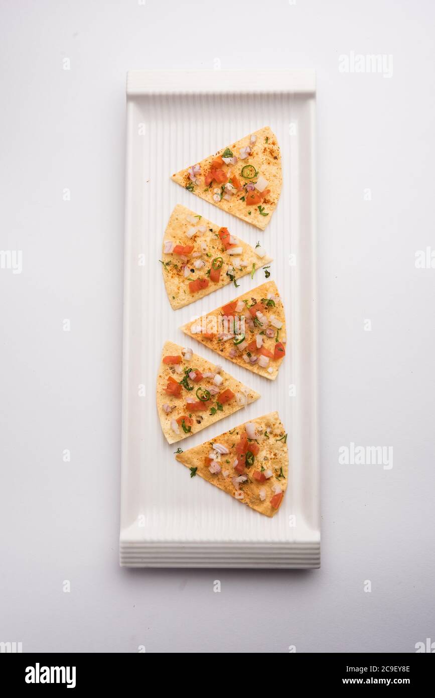 Masala Papad or papadum is a delicious Indian snack made using roasted ...