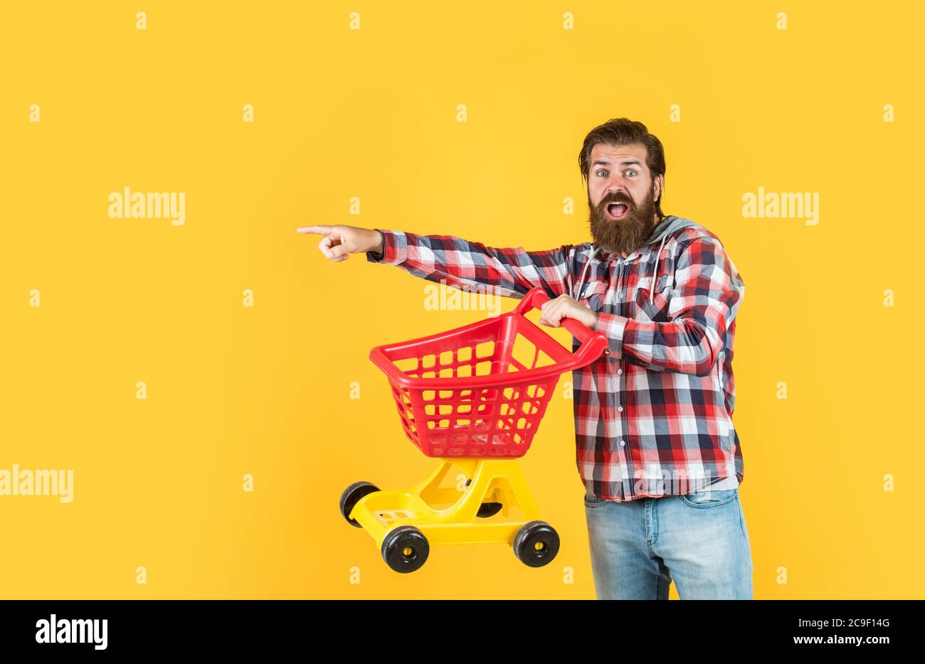 Real shopaholic. buyer in supermarket. empty toy trolley. really busy ...