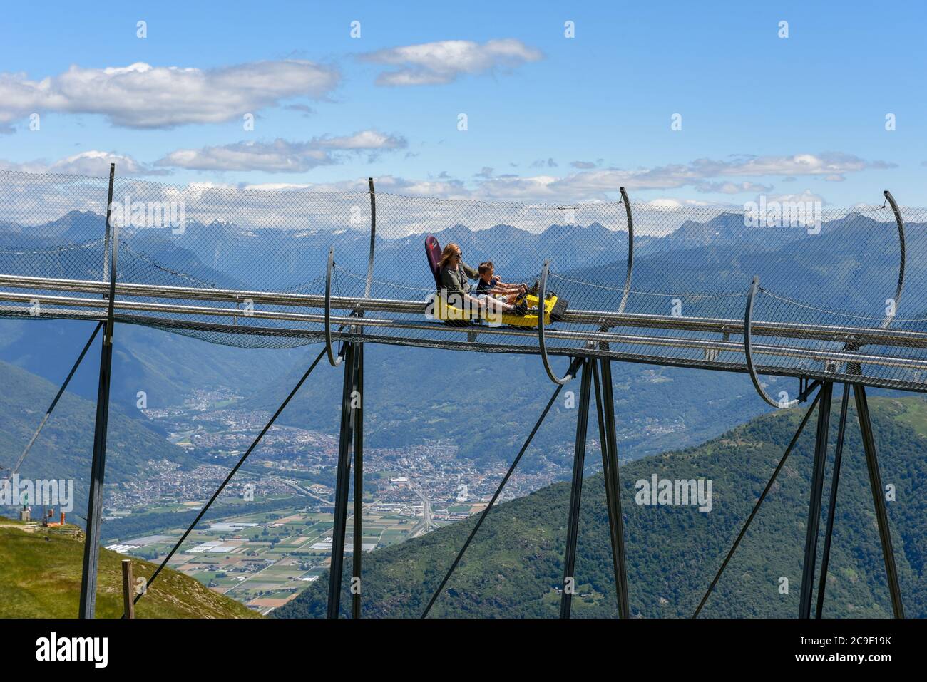 Mount Tamaro, Switzerland - 22 june 2020: people tobogganing on the ...
