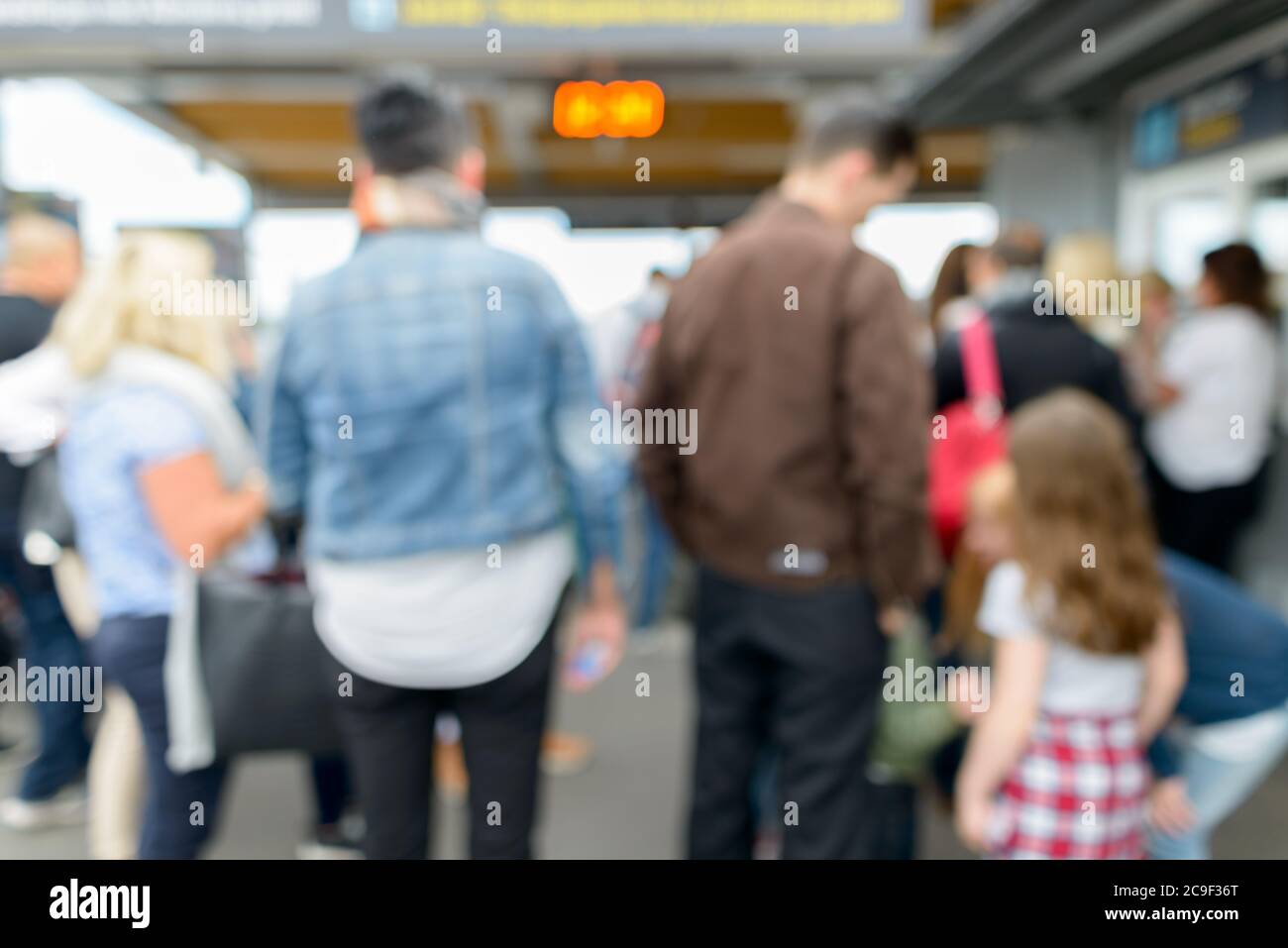 Portrait of blurred people standing and waiting outdoors Stock Photo ...
